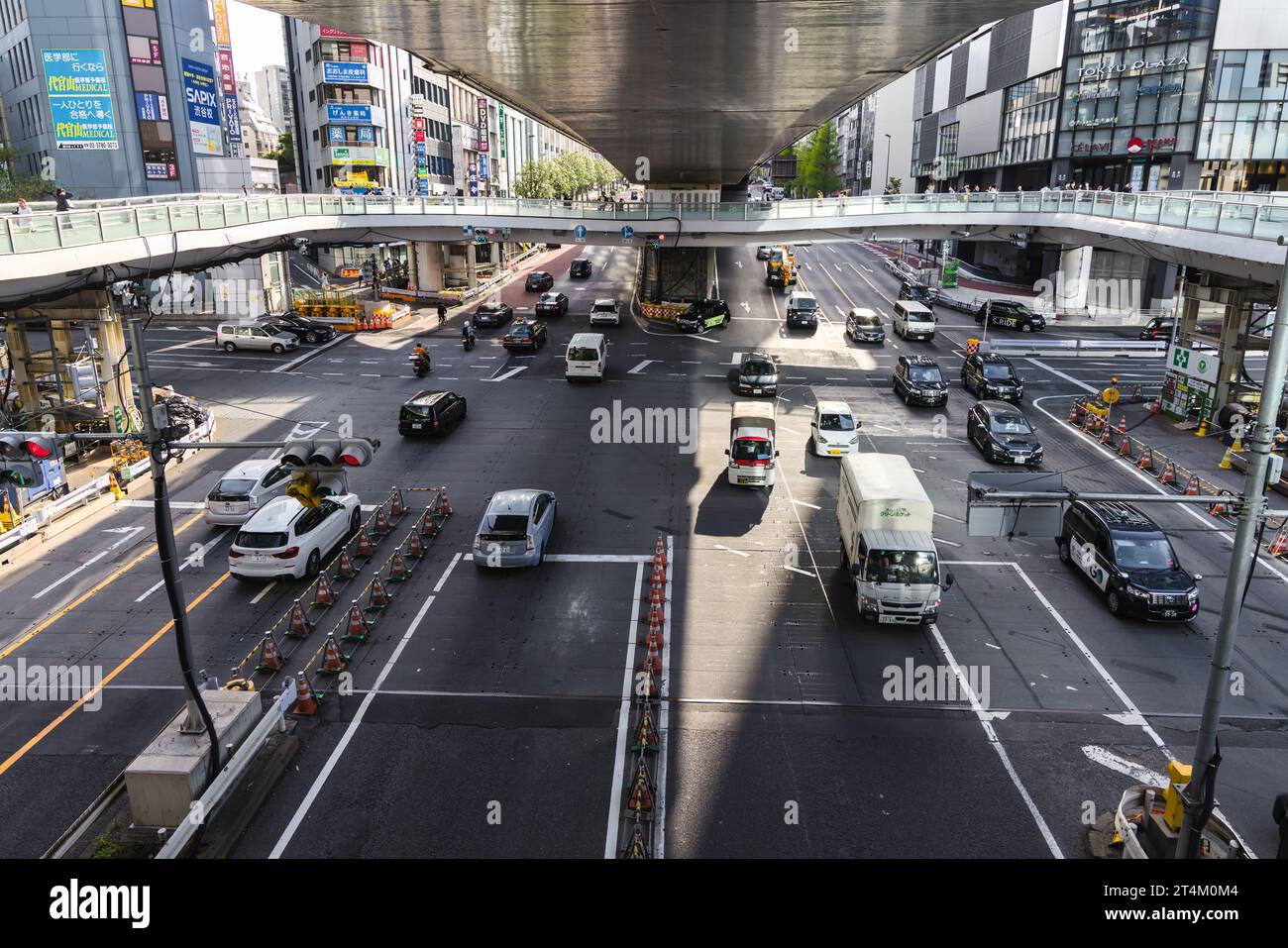 Tokyo, Japan - April 11, 2023: intersection with pedestrian overpasses ...