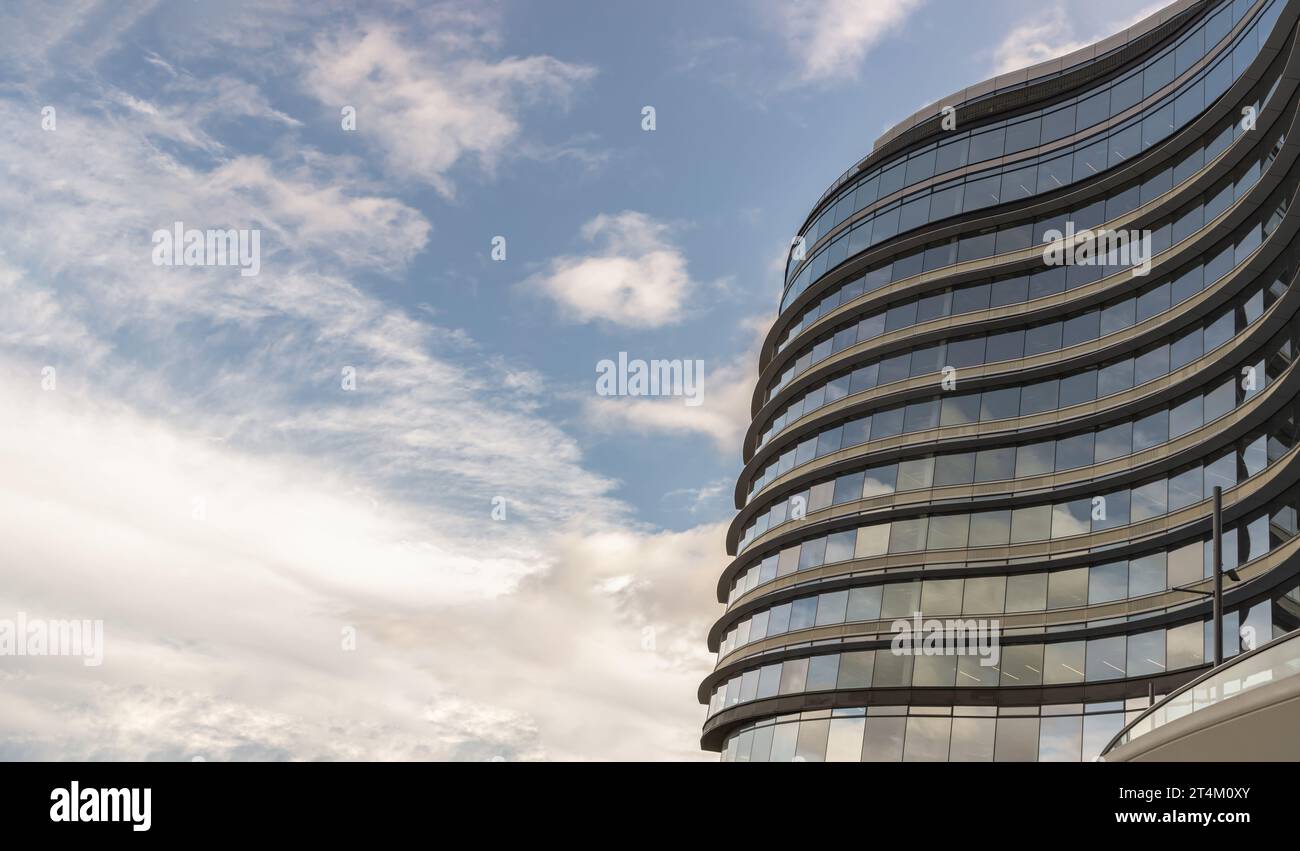 London, UK - Oct 16, 2023 - Blue sky and White clouds reflected in ...