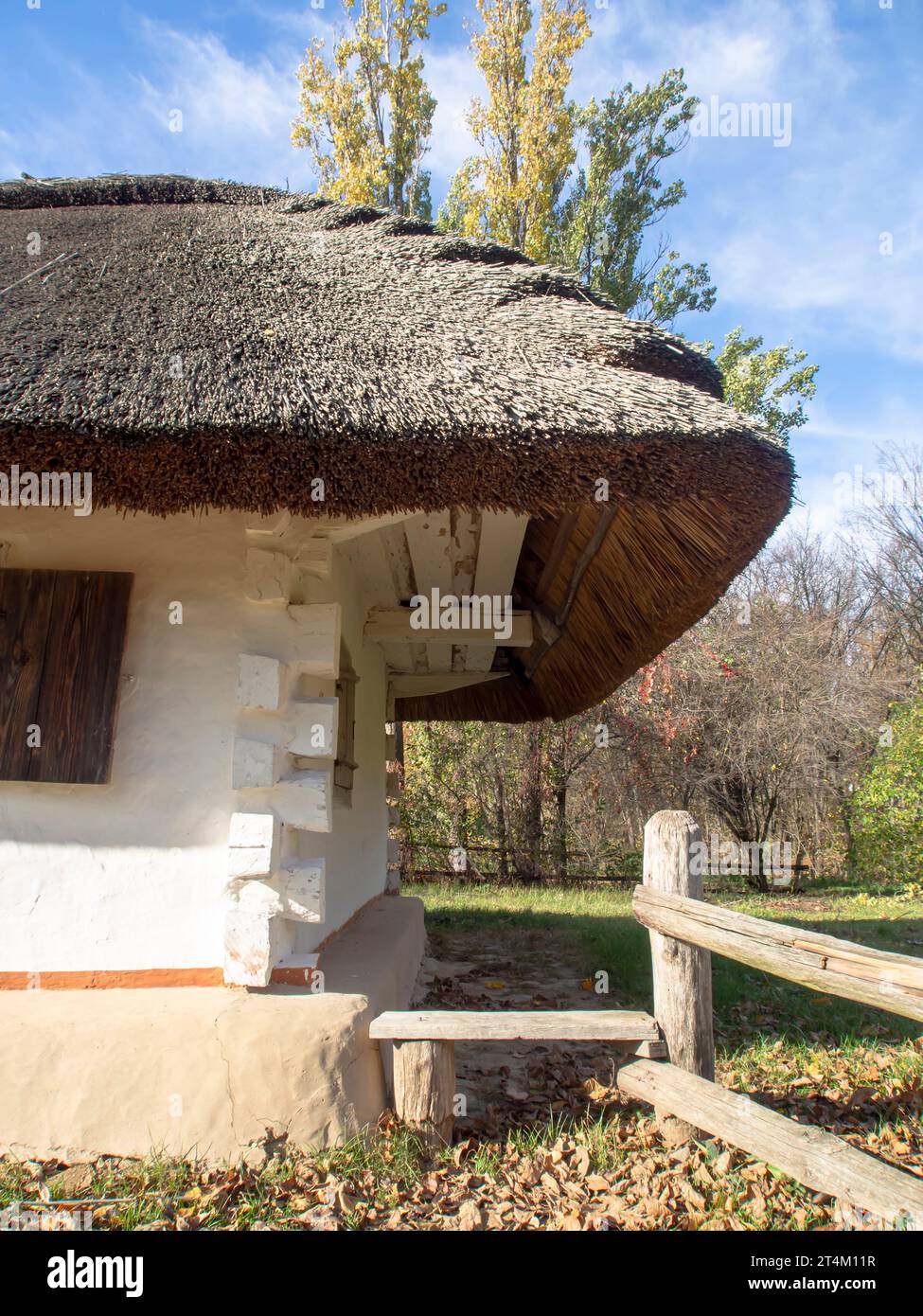 Traditional wooden homes with thatched roof in Ukraine. National Museum ...
