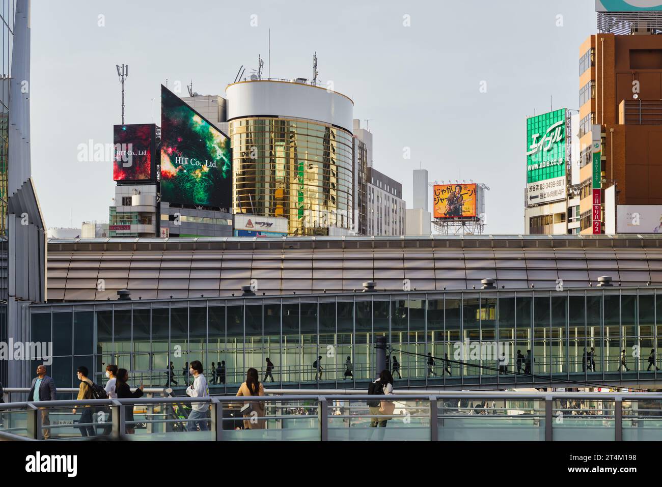 Tokyo, Japan - April 11, 2023: pedestrian skywalk in Shibuya, with ...