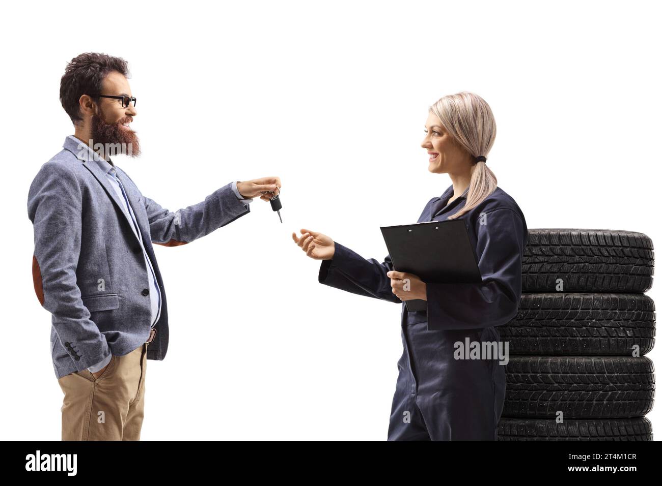 Man handing car keys to a female auto mechanic isolated on white ...