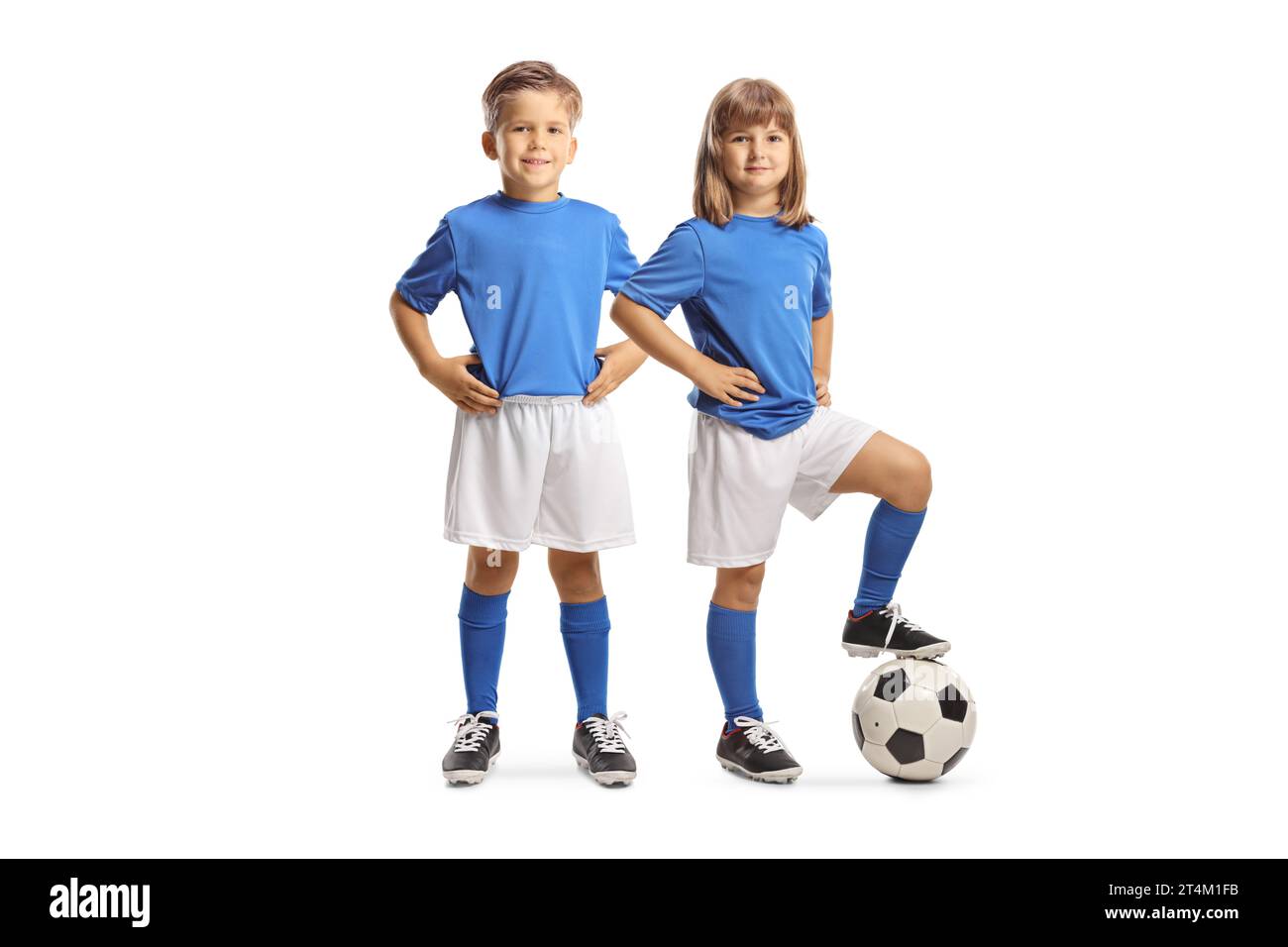 GIrl and boy in football kits posing with a ball isolated on white ...