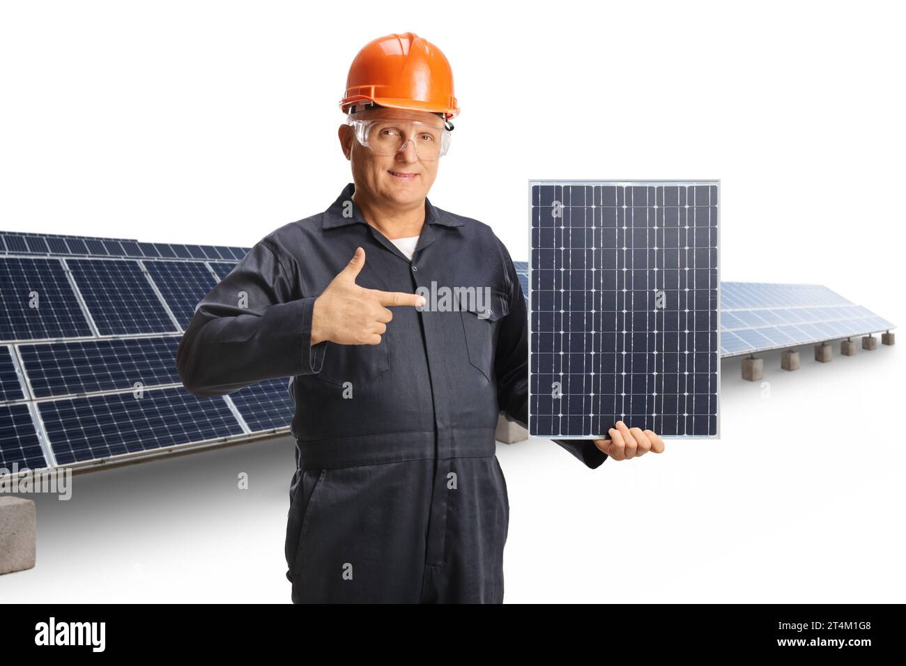 Technician in a uniform holding a photovoltaic panel at a solar farm ...