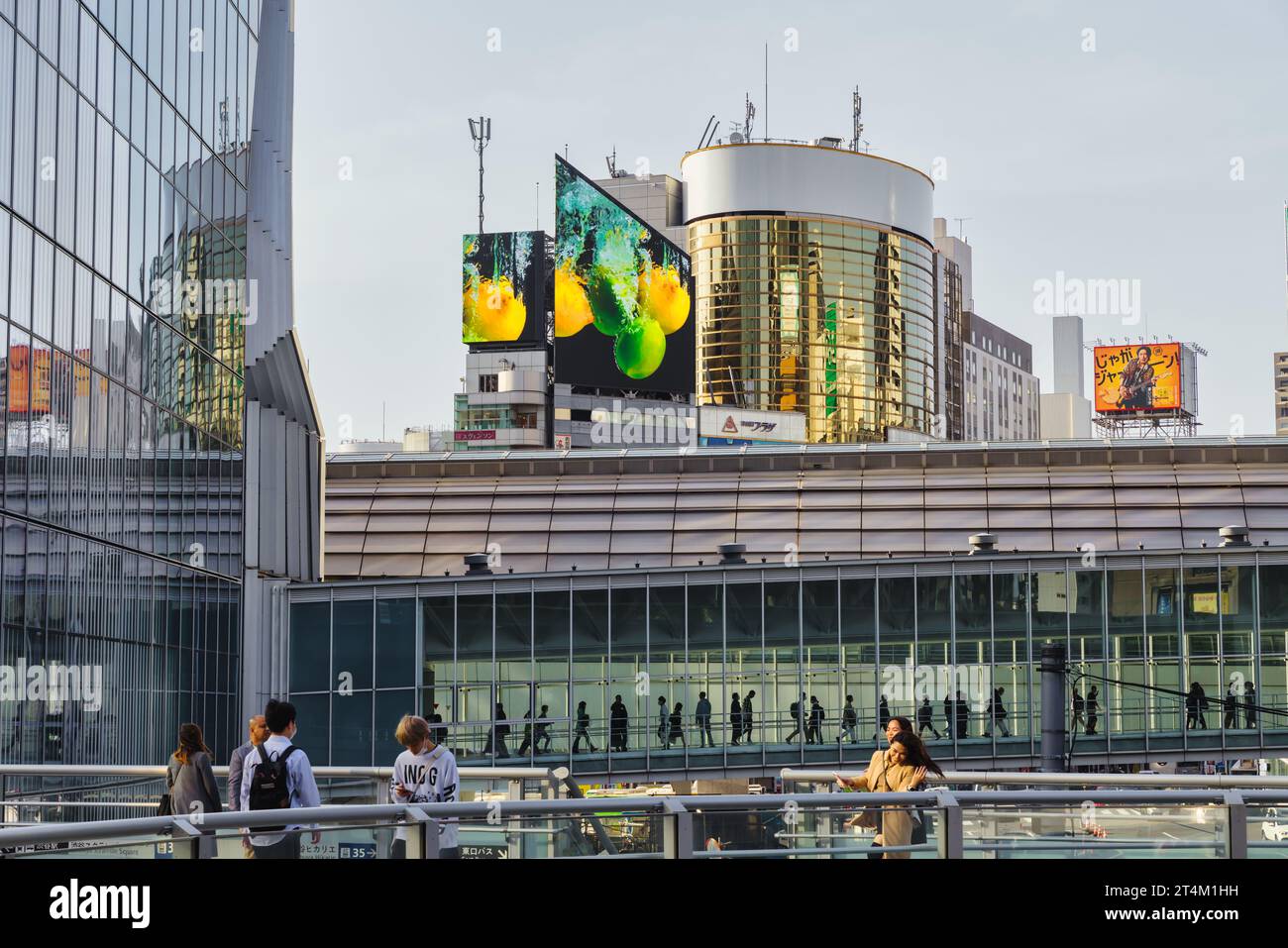 Tokyo, Japan - April 11, 2023: pedestrian skywalk in Shibuya, with ...