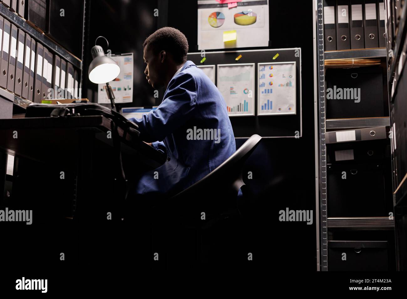 African american police officer working at crime case late at night ...