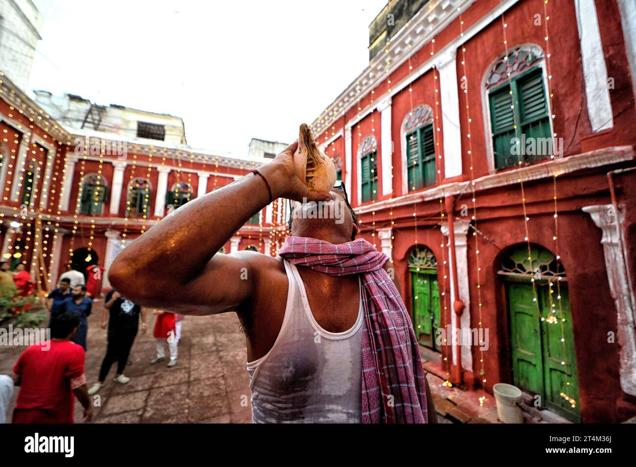 A Hindu devotee seen using a Conch before the immersion of Devi Durga ...