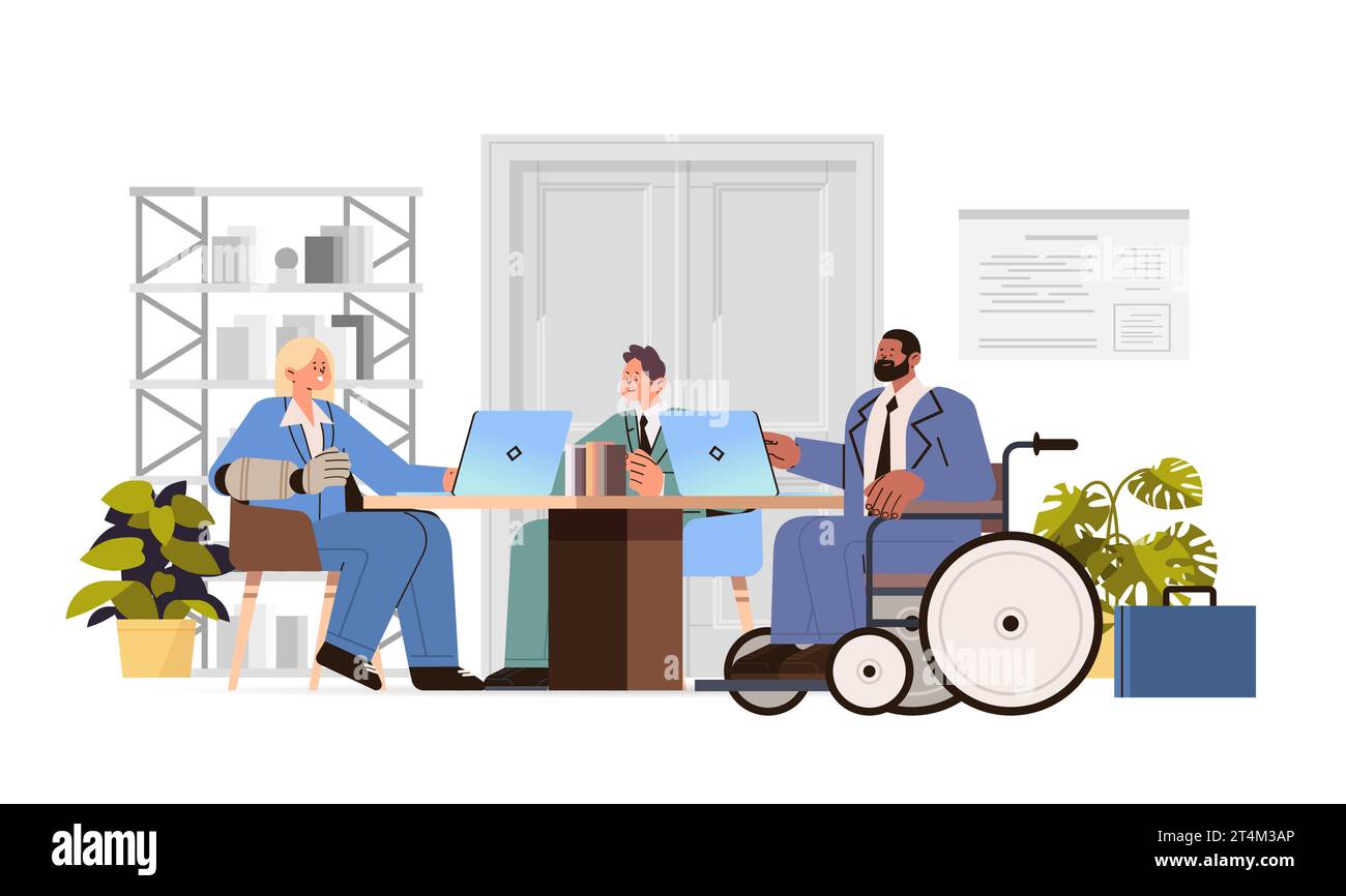 disabled businessman in wheelchair discussing with coworkers in office ...