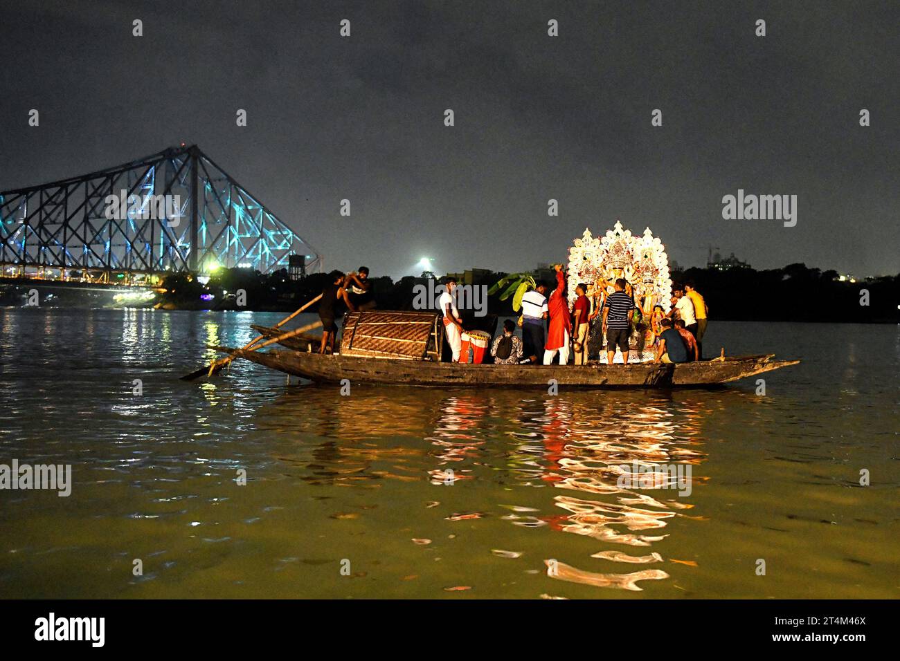 Kolkata, India. 24th Oct, 2023. Hindu devotees carry a clay statue of ...