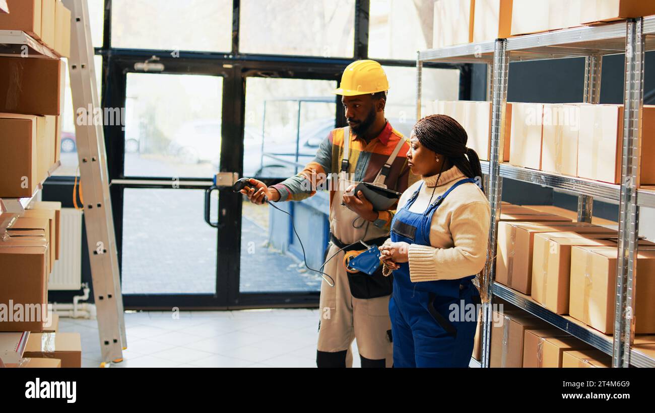 Warehouse employees scanning retail products on racks, working with ...