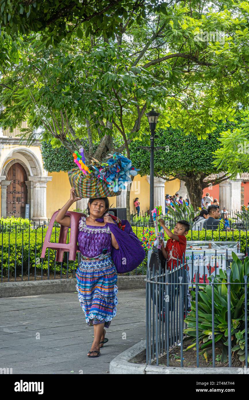 Guatemala, La Antigua - July 20, 2023: Famale vendor in colorful ...