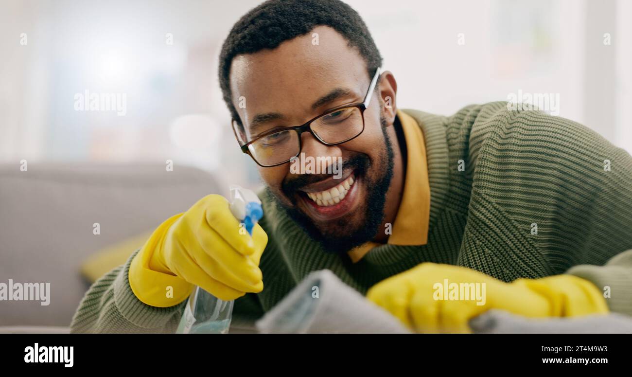 Cleaning, happy and man with spray for furniture in living room for ...