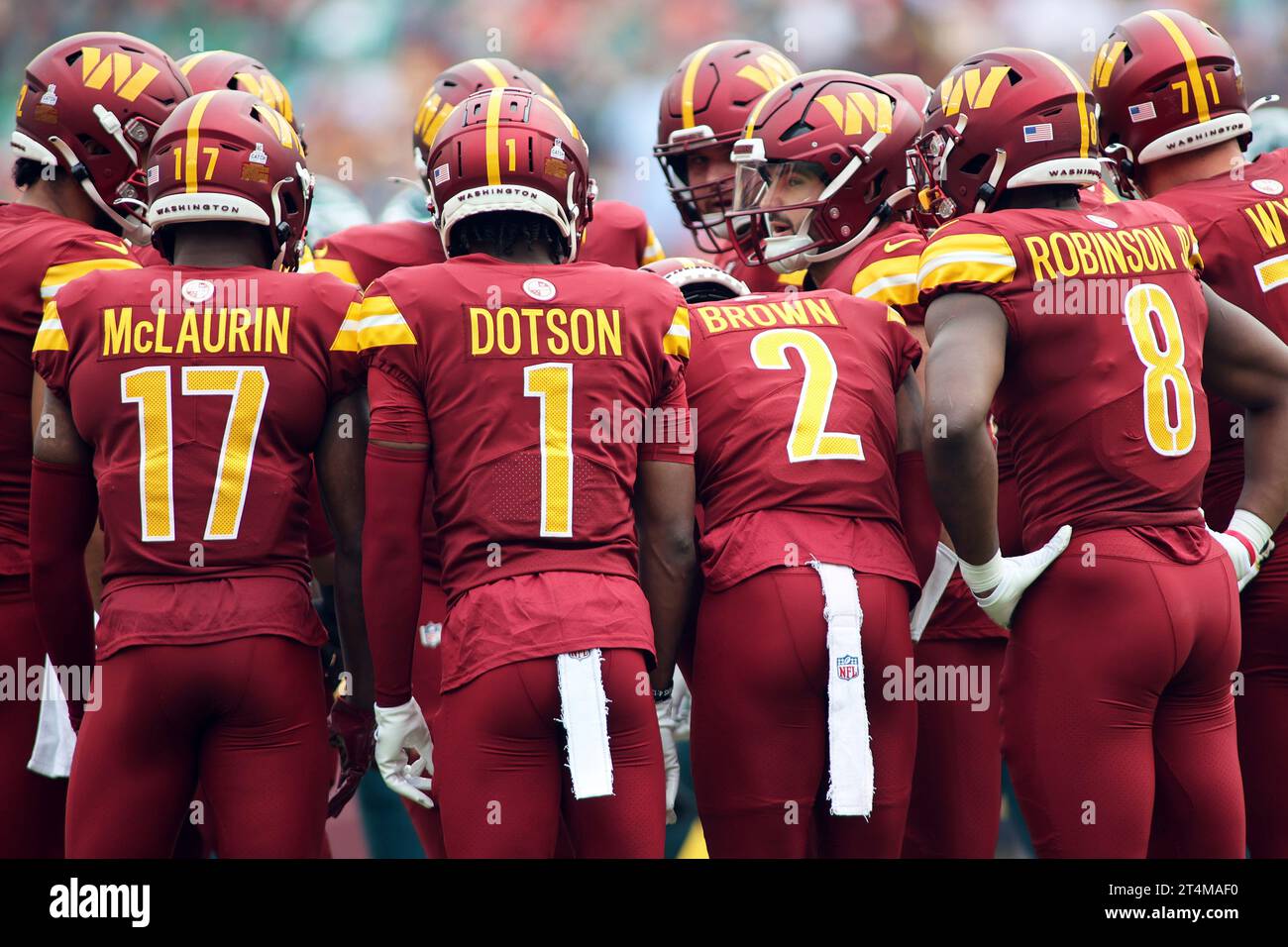 The Washington Commanders huddle up during an NFL football game against ...