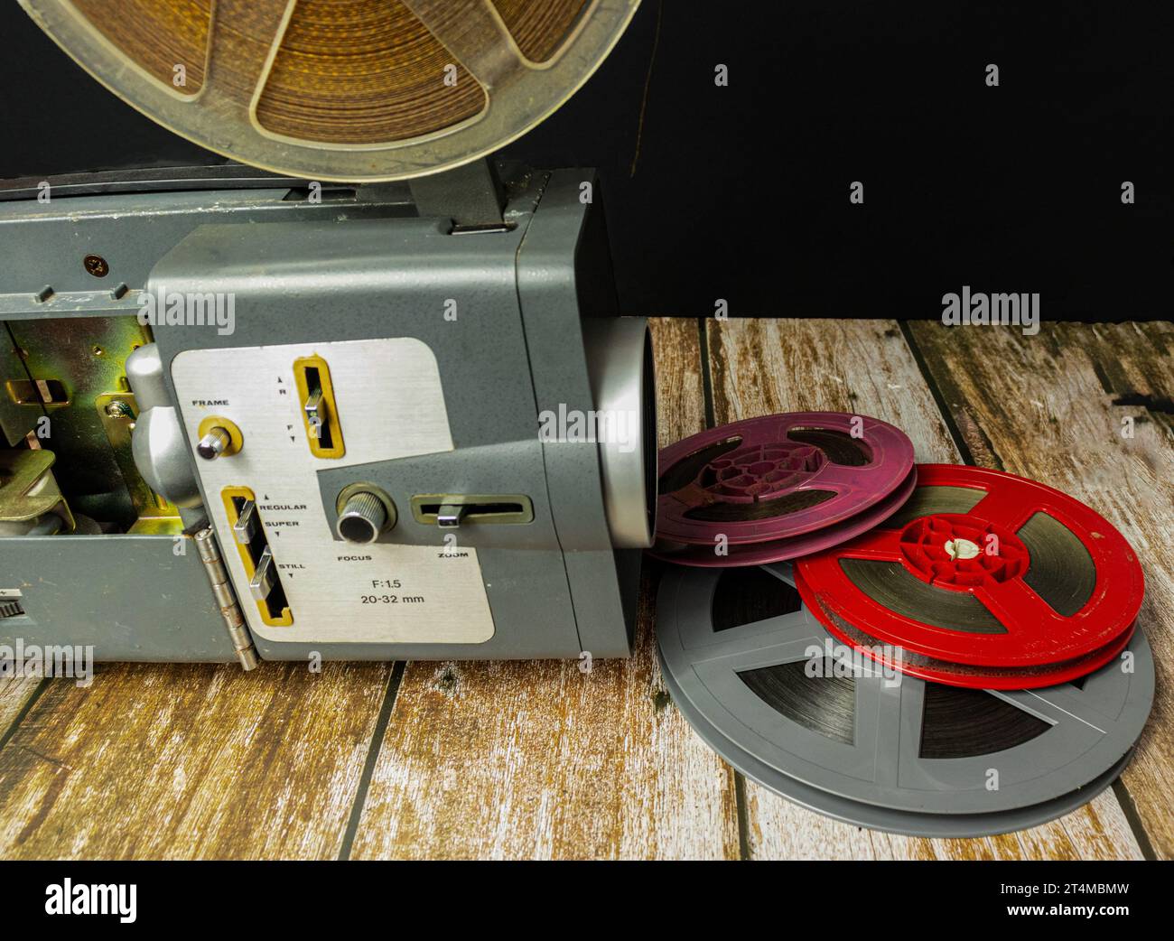 old movie projector and reel of tapes Stock Photo - Alamy