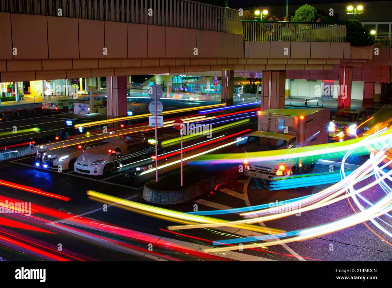 A night timelapse of traffic jam at the bus rotary in Tokyo telephoto ...