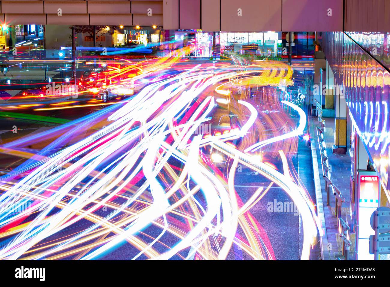 A night timelapse of traffic jam at the bus rotary in Tokyo telephoto ...