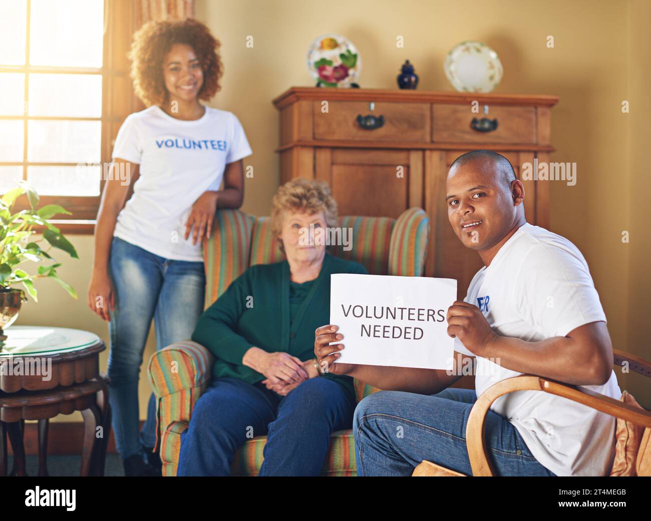 Volunteers needed. volunteer workers at a retirement home Stock Photo ...