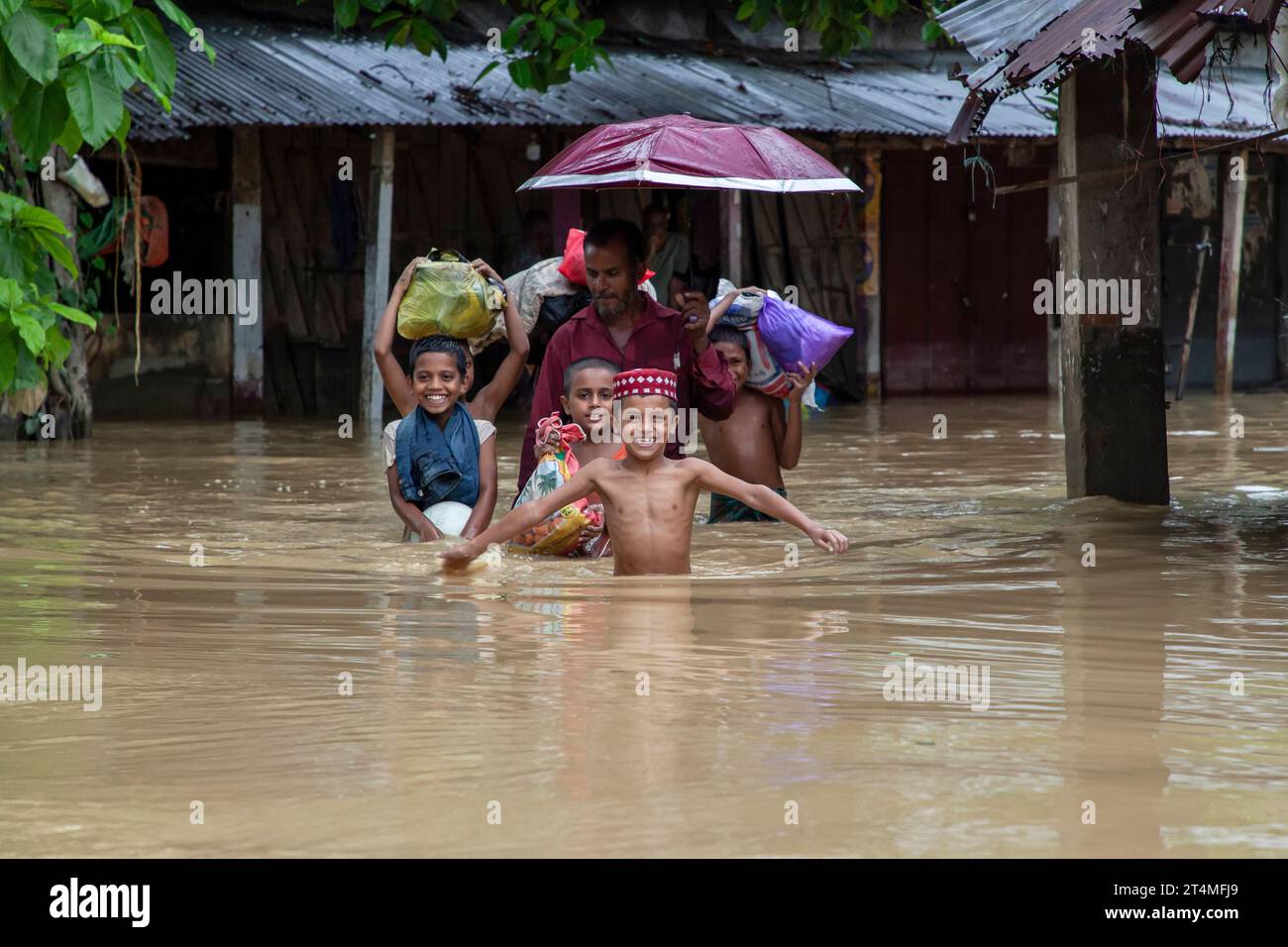People walking through floodwater, Satkania Upazila, Bangladesh Stock Photo - Alamy