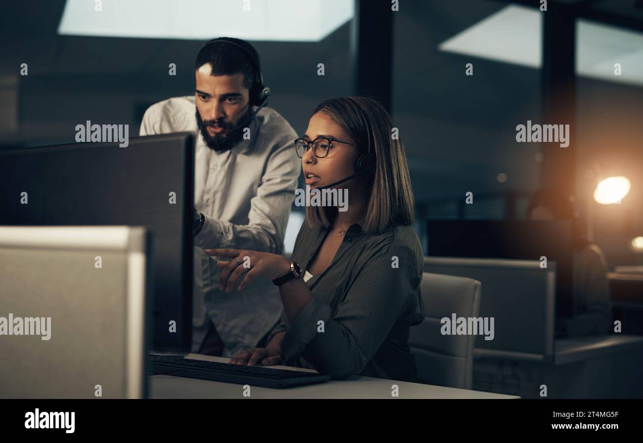 Lets troubleshoot some more. two call centre agents working together in ...