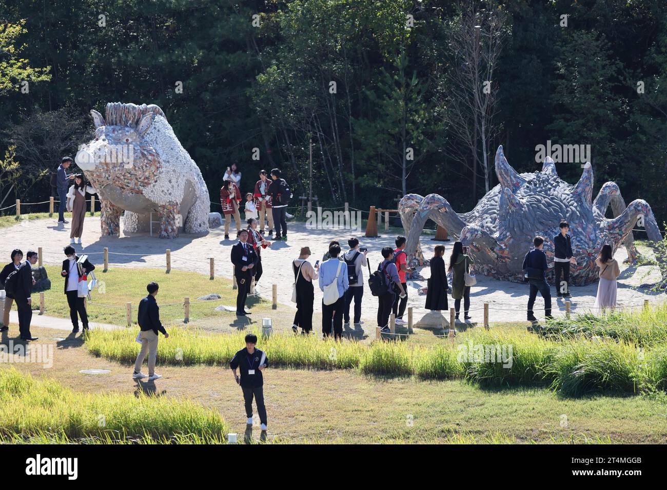People visit the Mononoke Village area at Ghibli Park in Nagakute, Aich ...
