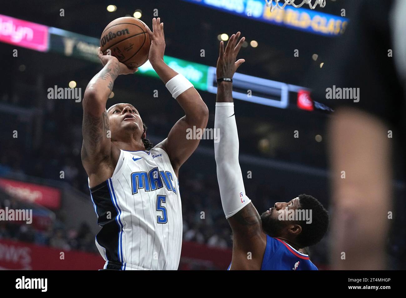 Orlando Magic forward Paolo Banchero, left, shoots as Los Angeles ...