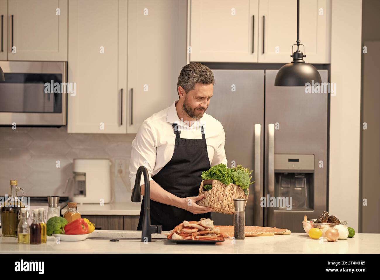 photo of man cooking healthy food. man cooking healthy food. man ...