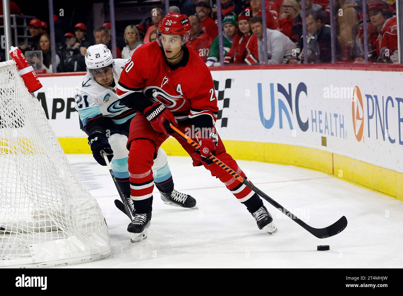 Carolina Hurricanes' Sebastian Aho (20) protects the puck from Seattle ...
