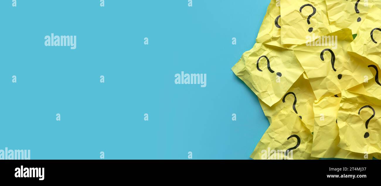 Questions and answers concept QnA. Yellow and crumpled memo note ...