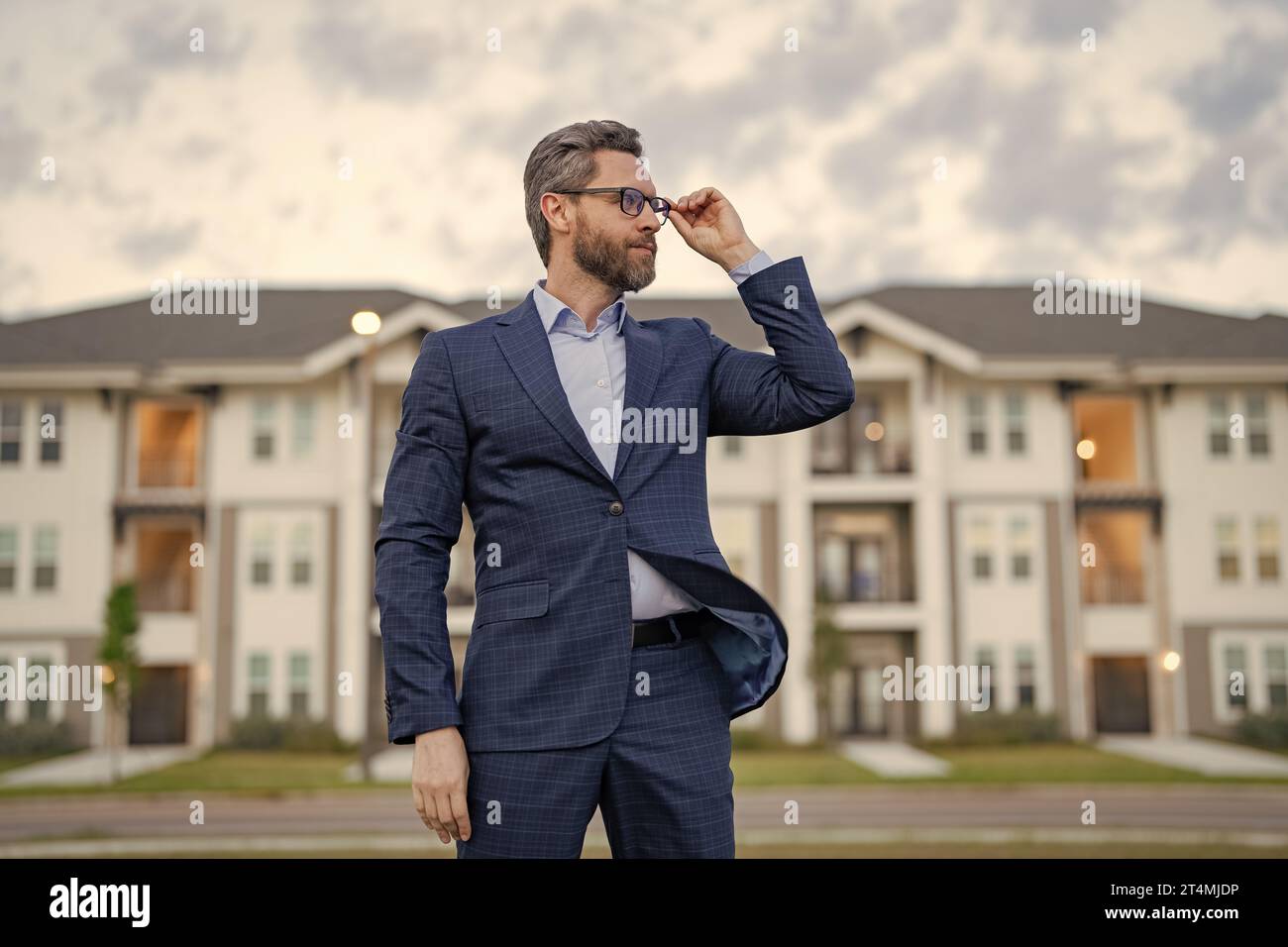 man realtor at the house. man realtor in the suit. man realtor outdoor ...