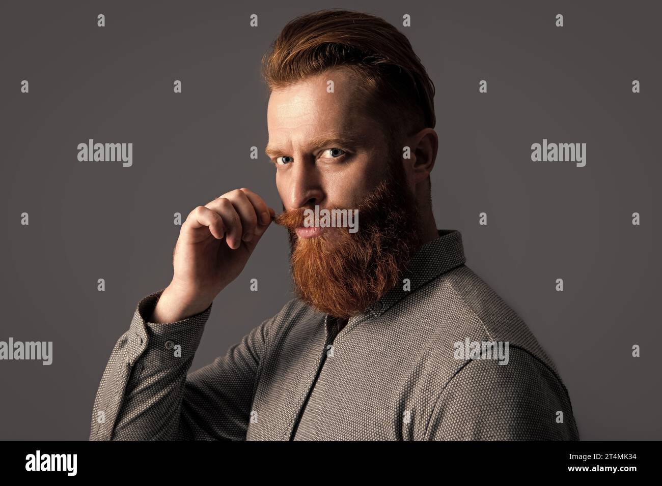 Portrait of Irish man twirling mustache half turn. Bearded man with ...