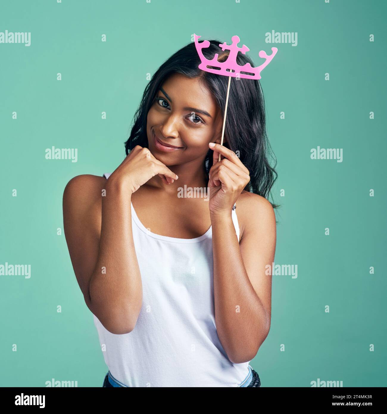 Im a princess. Studio portrait of a beautiful young woman posing with a ...