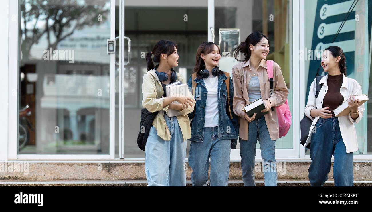Group of Young Asian student walking and talking at university before ...