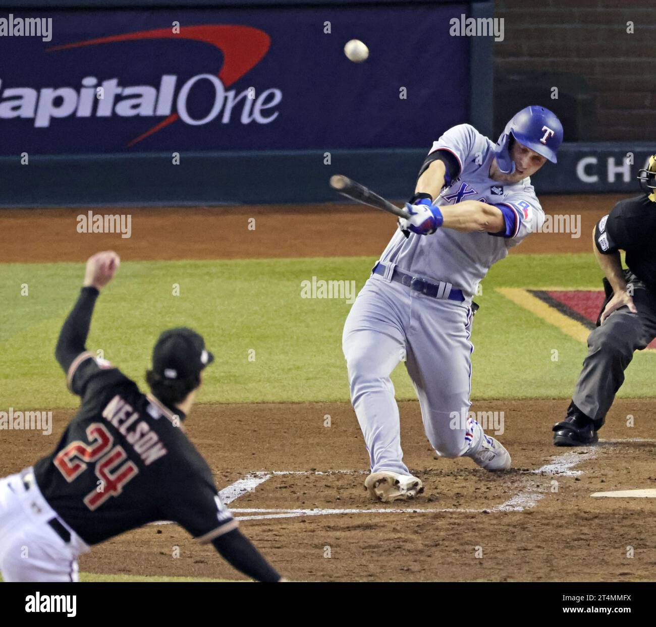 Corey Seager of the Texas Rangers hits a two-run home run off Arizona Diamondbacks relief ...