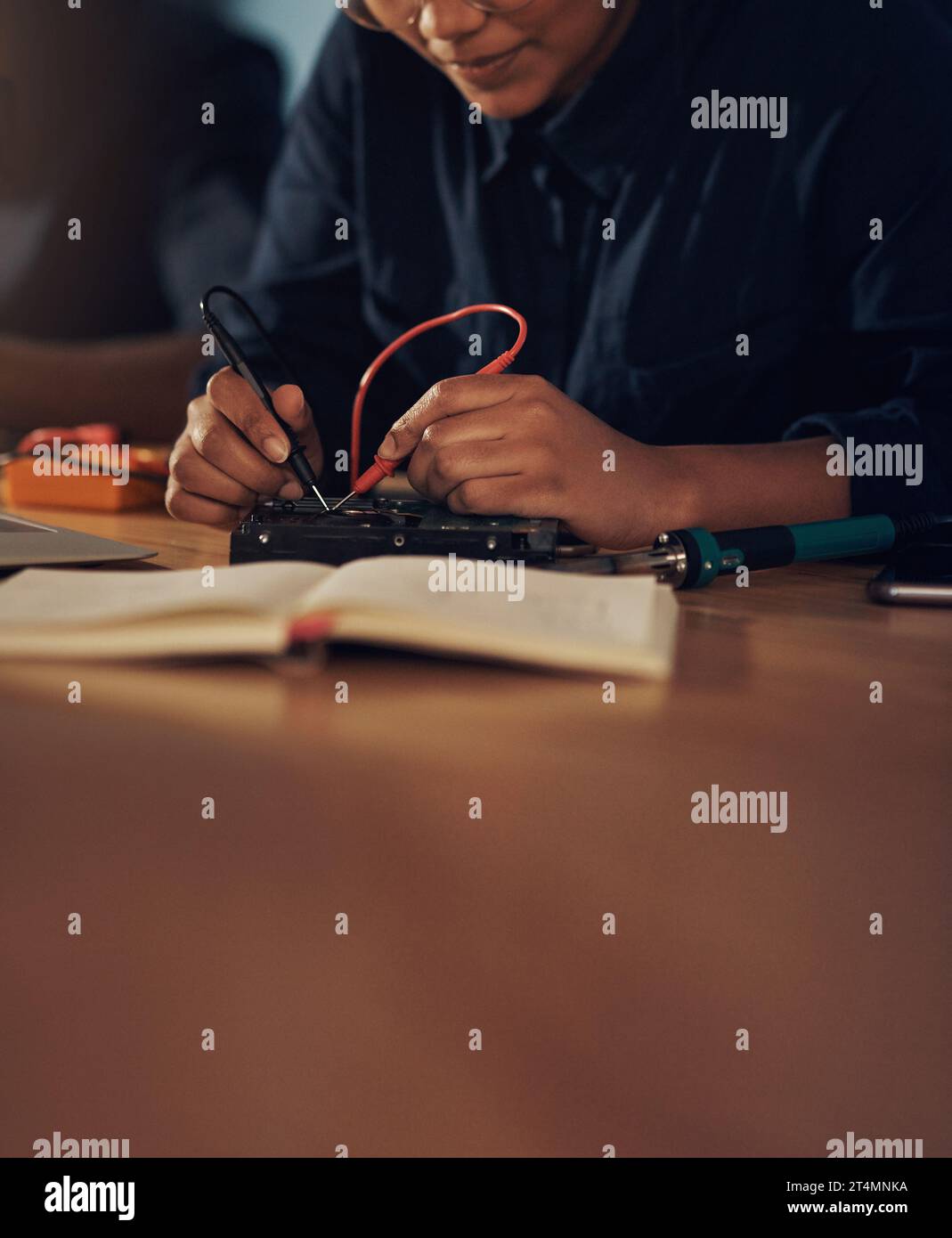 Giving band new life to broken computer hardware. an unrecognisable ...