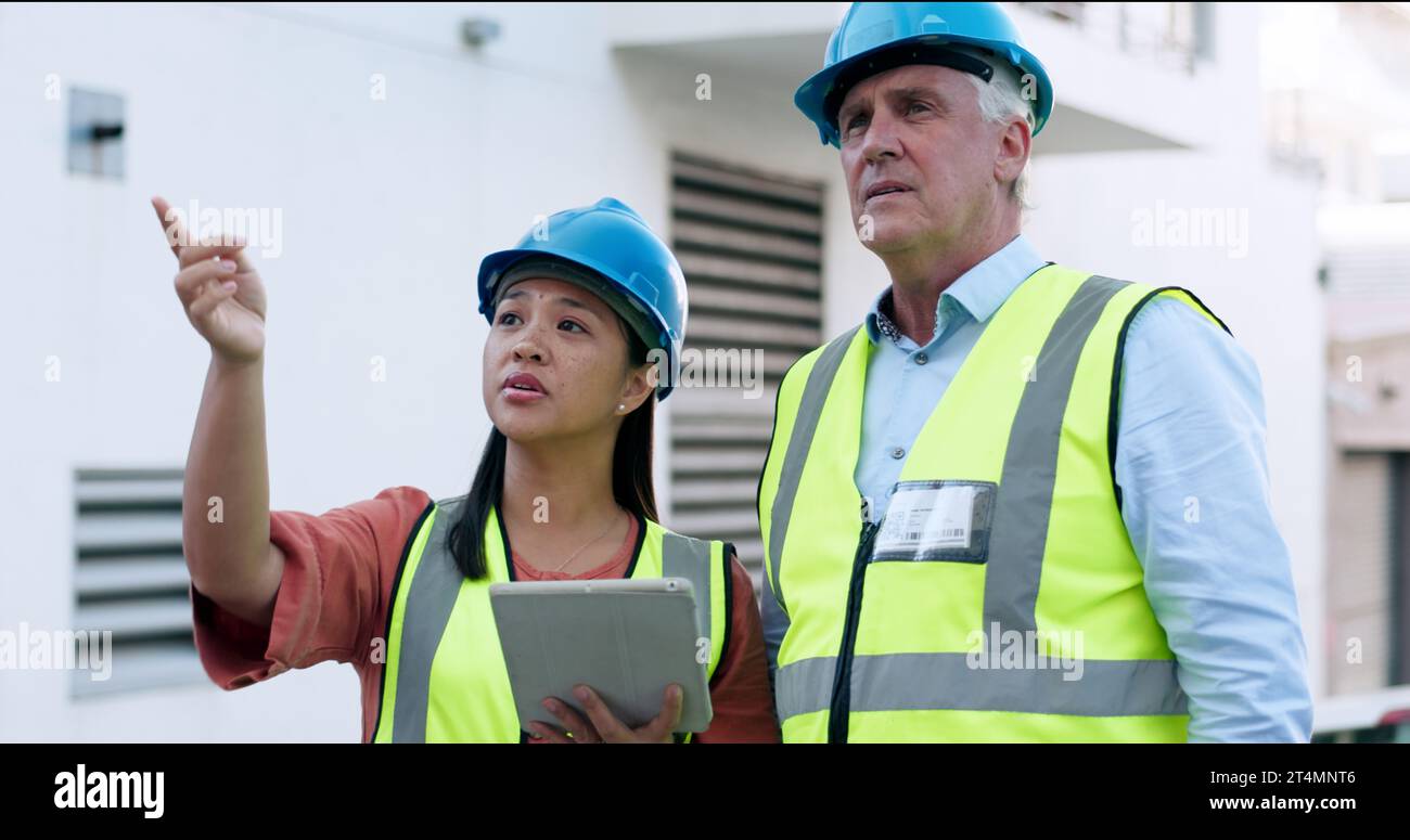 Construction, team and tablet for inspection with people at job site, mentor and apprentice with ...