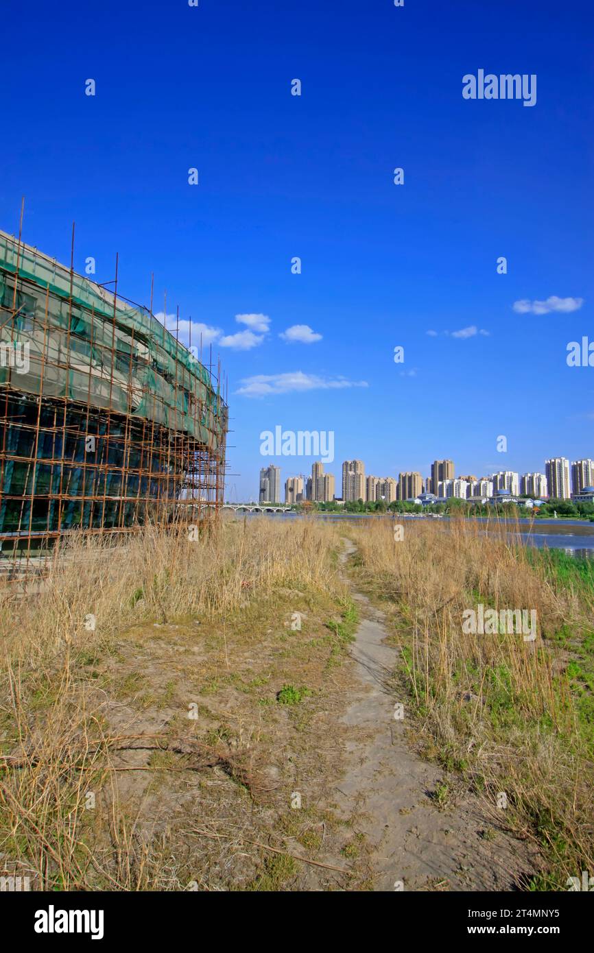 Unfinished high-rise buildings in the city, closeup of photo Stock ...