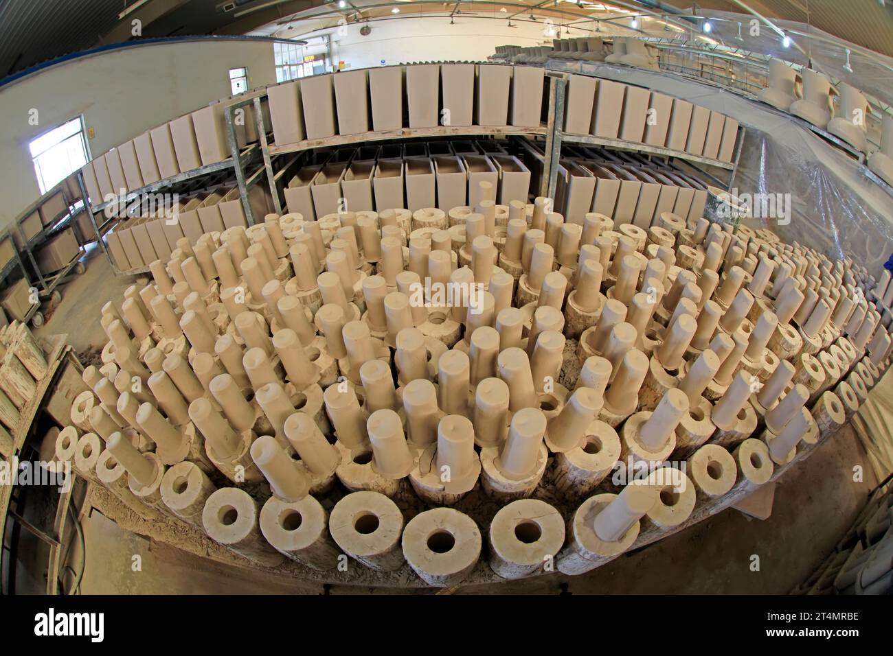 Ceramic unpainted clay idol in production workshop, closeup of photo ...