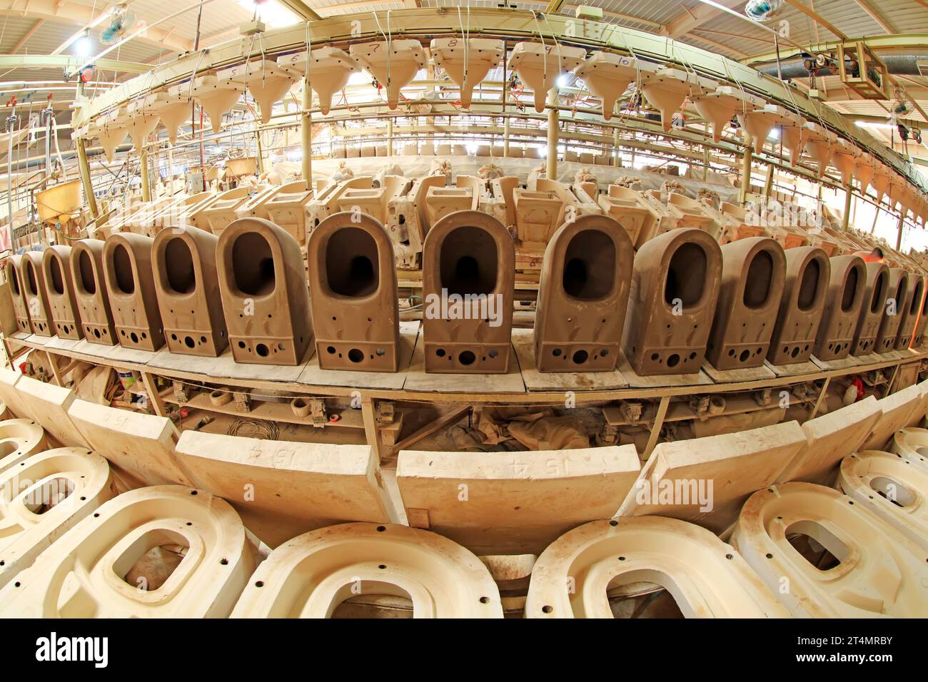 toilet unpainted clay idol in production workshop, closeup of photo ...