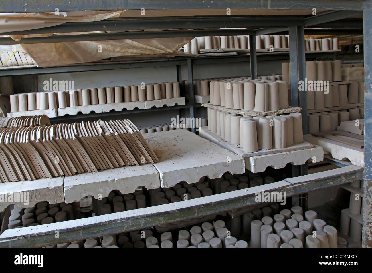 Unpainted clay idol mould in a factory, closeup of photo Stock Photo ...