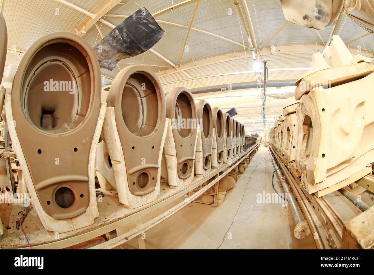 toilet unpainted clay idol in production workshop, closeup of photo ...