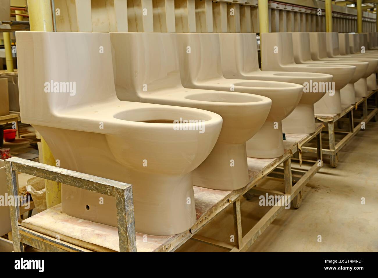 toilet unpainted clay idol in production workshop, closeup of photo ...