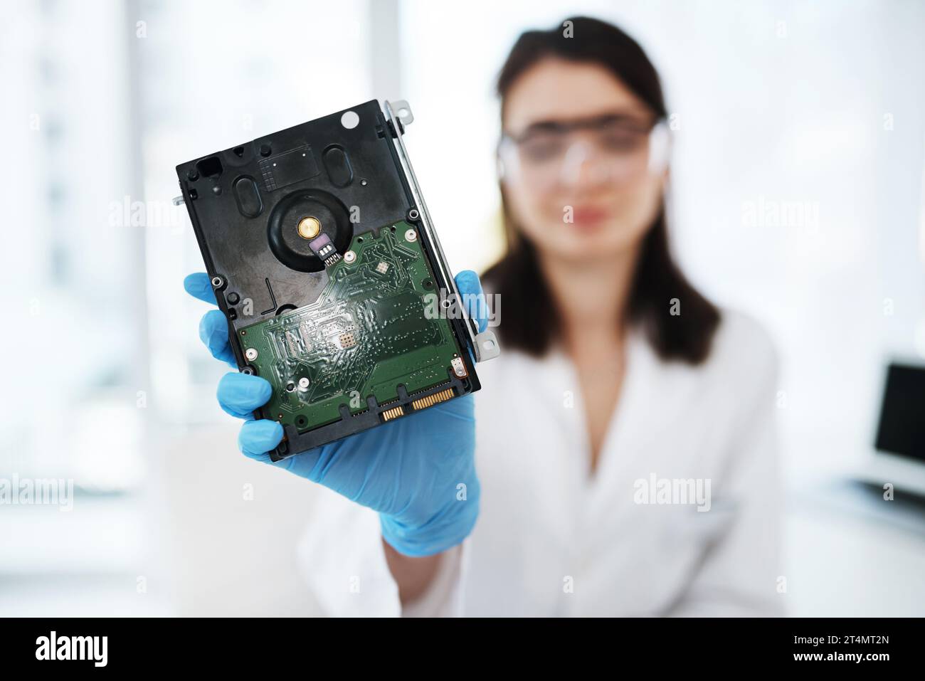 Repaired and ready for use. a young woman repairing computer hardware ...