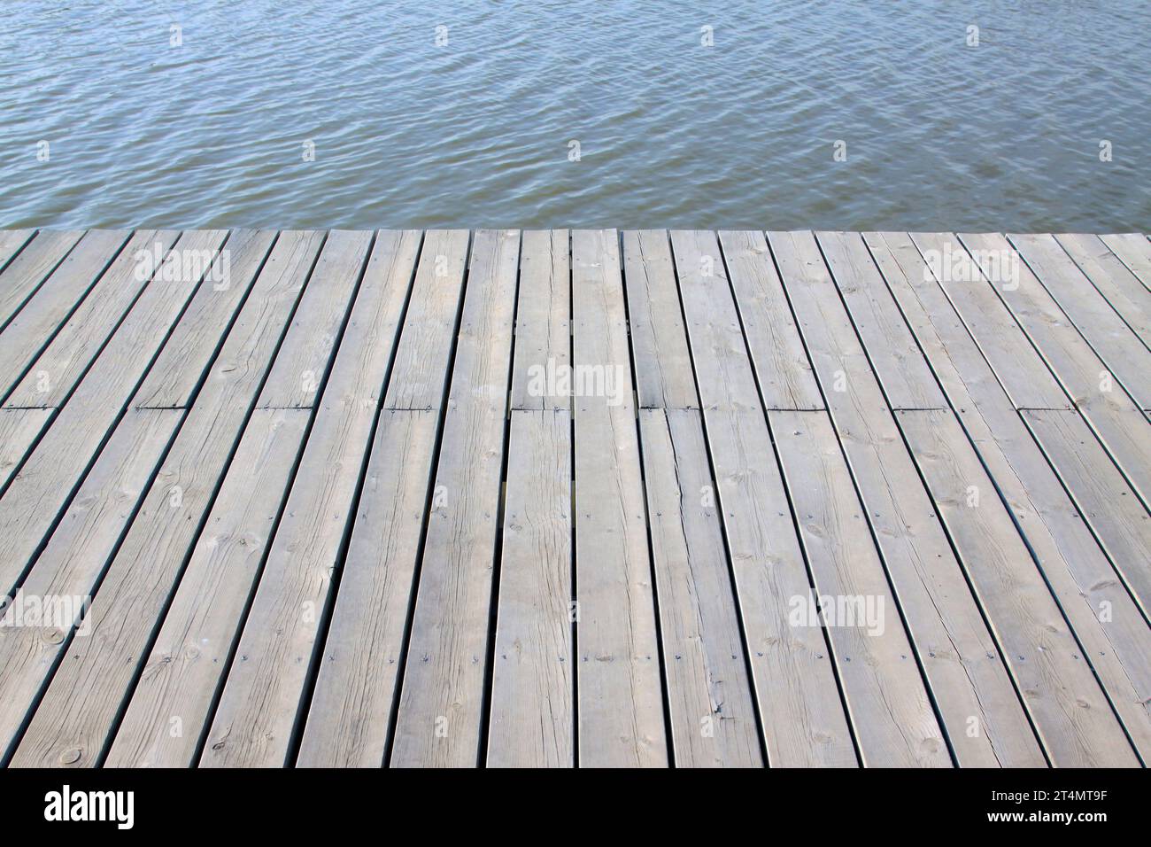 Wooden platform by the water Stock Photo - Alamy