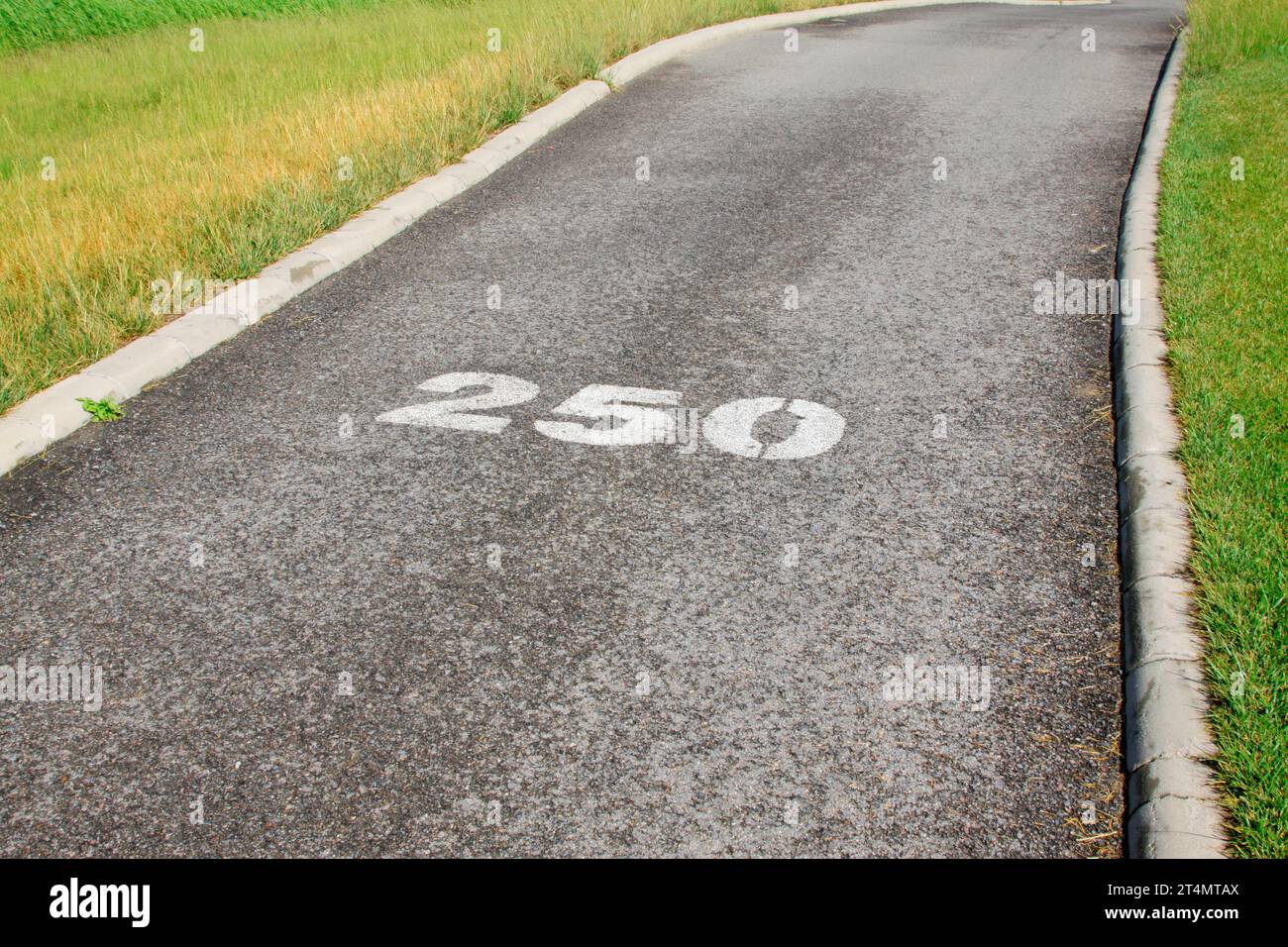 Numbers on the asphalt road Stock Photo - Alamy
