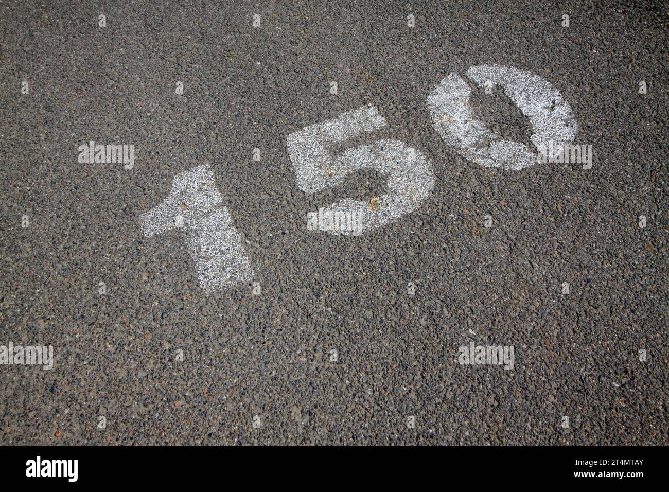 Numbers on the asphalt road Stock Photo - Alamy