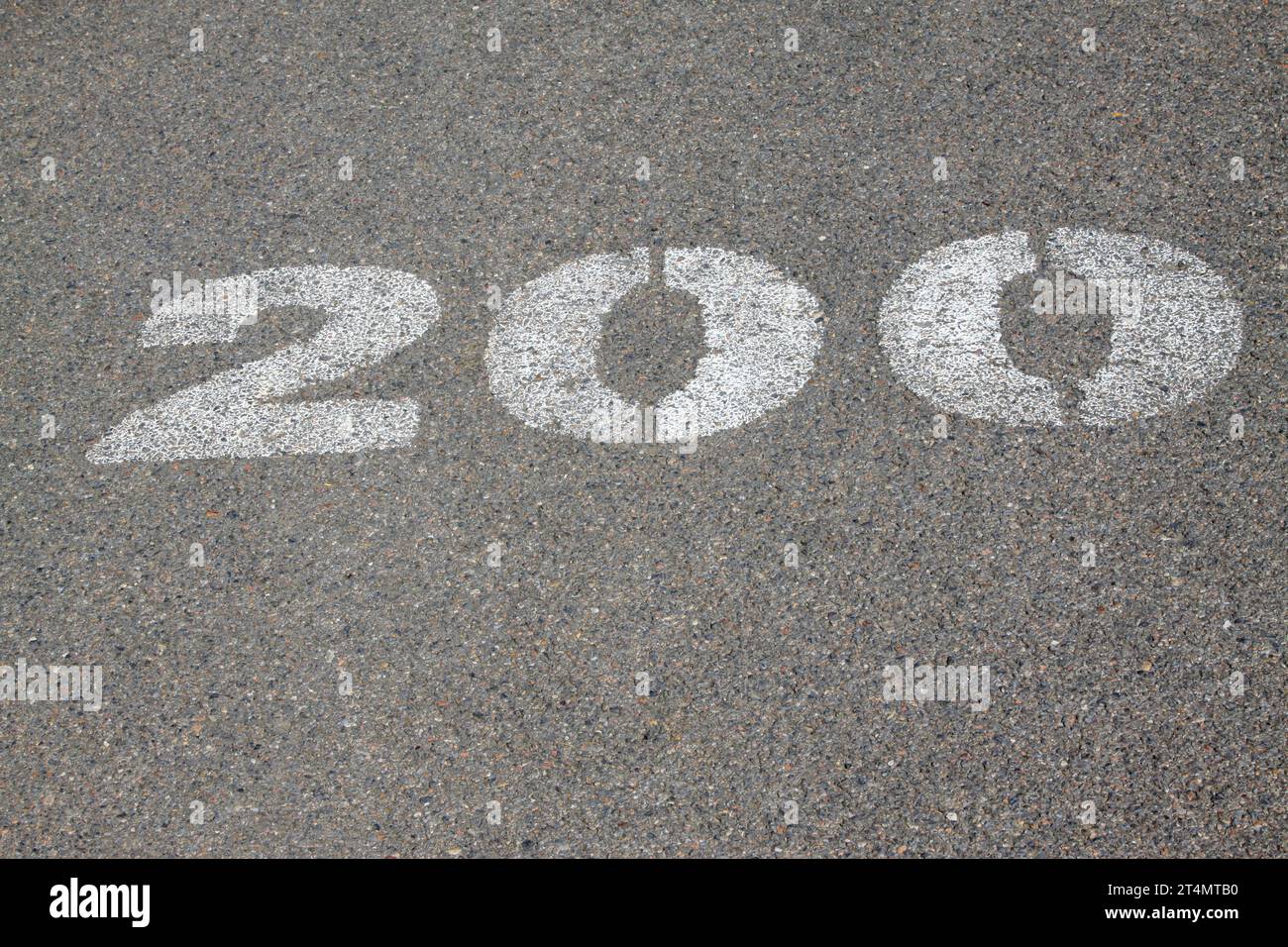 Numbers on the asphalt road Stock Photo - Alamy