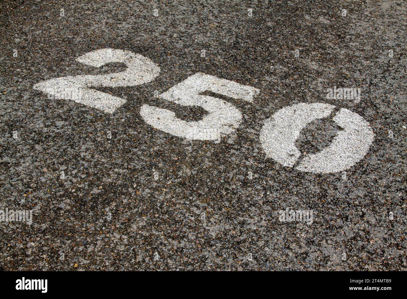 Numbers on the asphalt road Stock Photo - Alamy