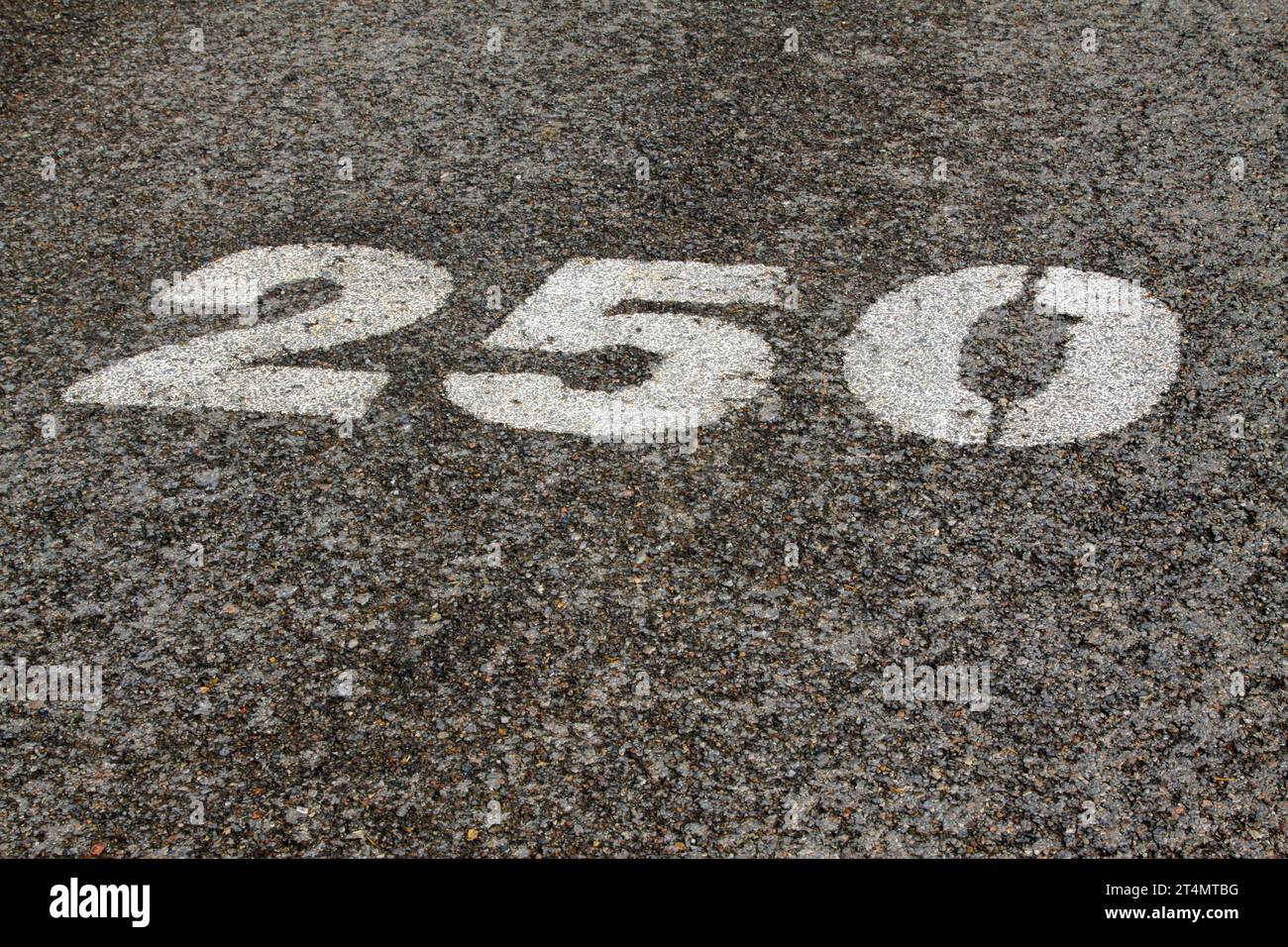 Numbers on the asphalt road Stock Photo - Alamy