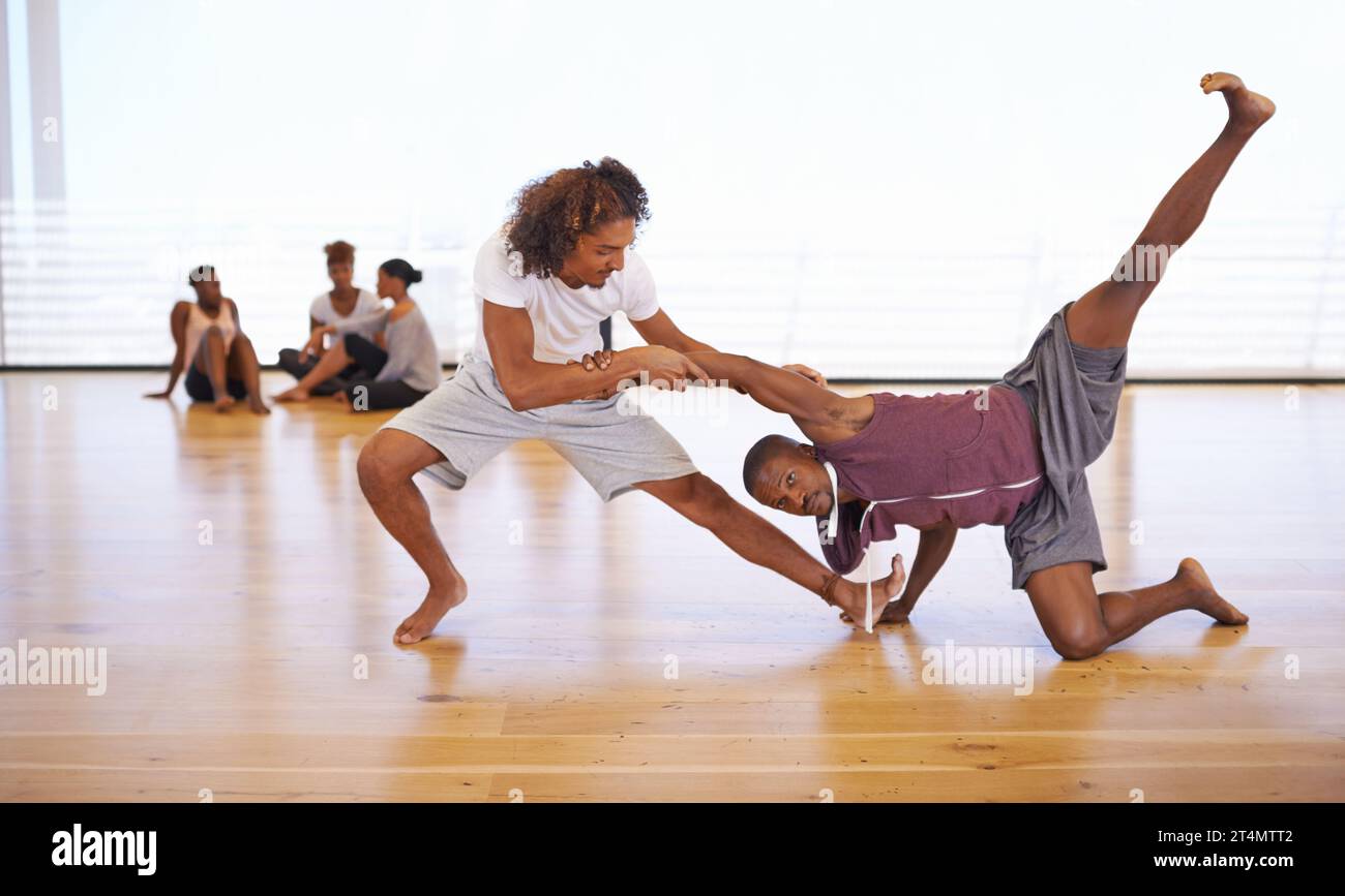 Expressing themselves through dance. two young dancers rehearsing ...