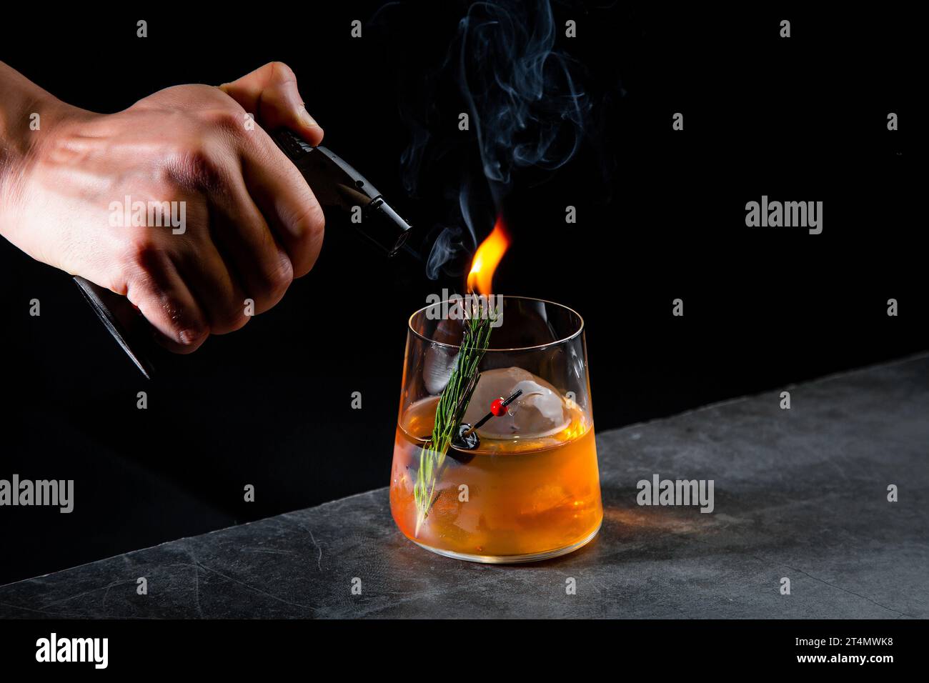 Bartender prepares delicious alcoholic cocktail hi-res stock ...