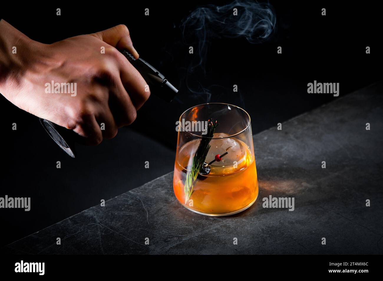 Bartender prepares delicious alcoholic cocktail hi-res stock ...